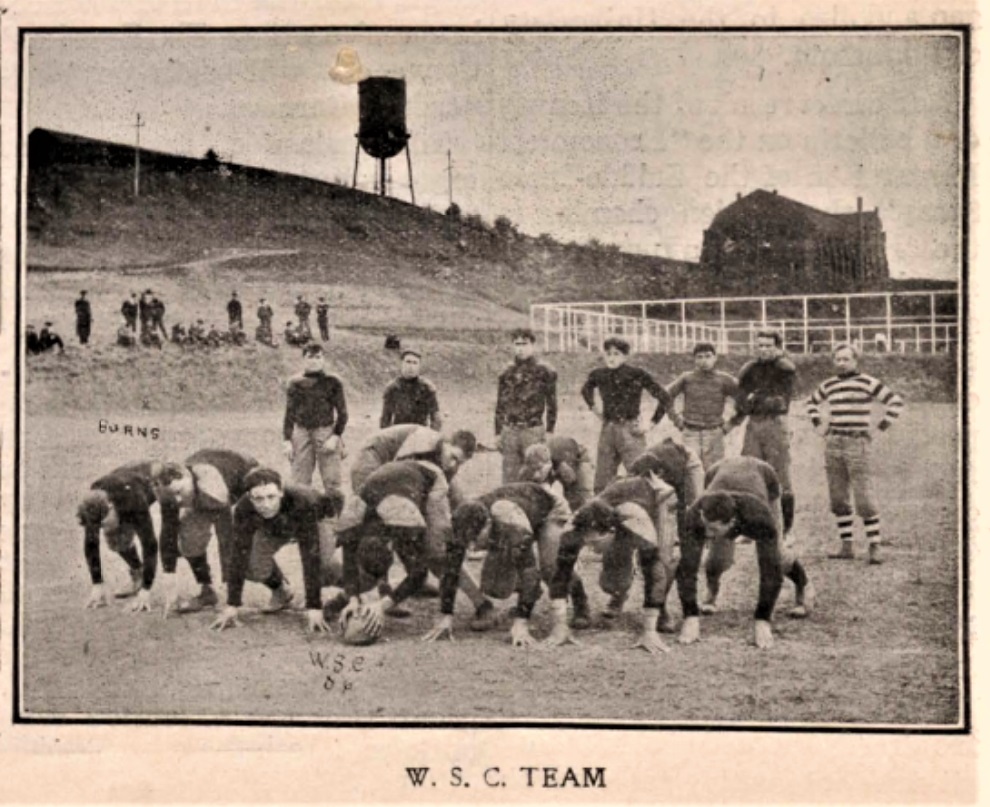 A striped Bender watching his 1906 Washington State College team » GoCoogs.com