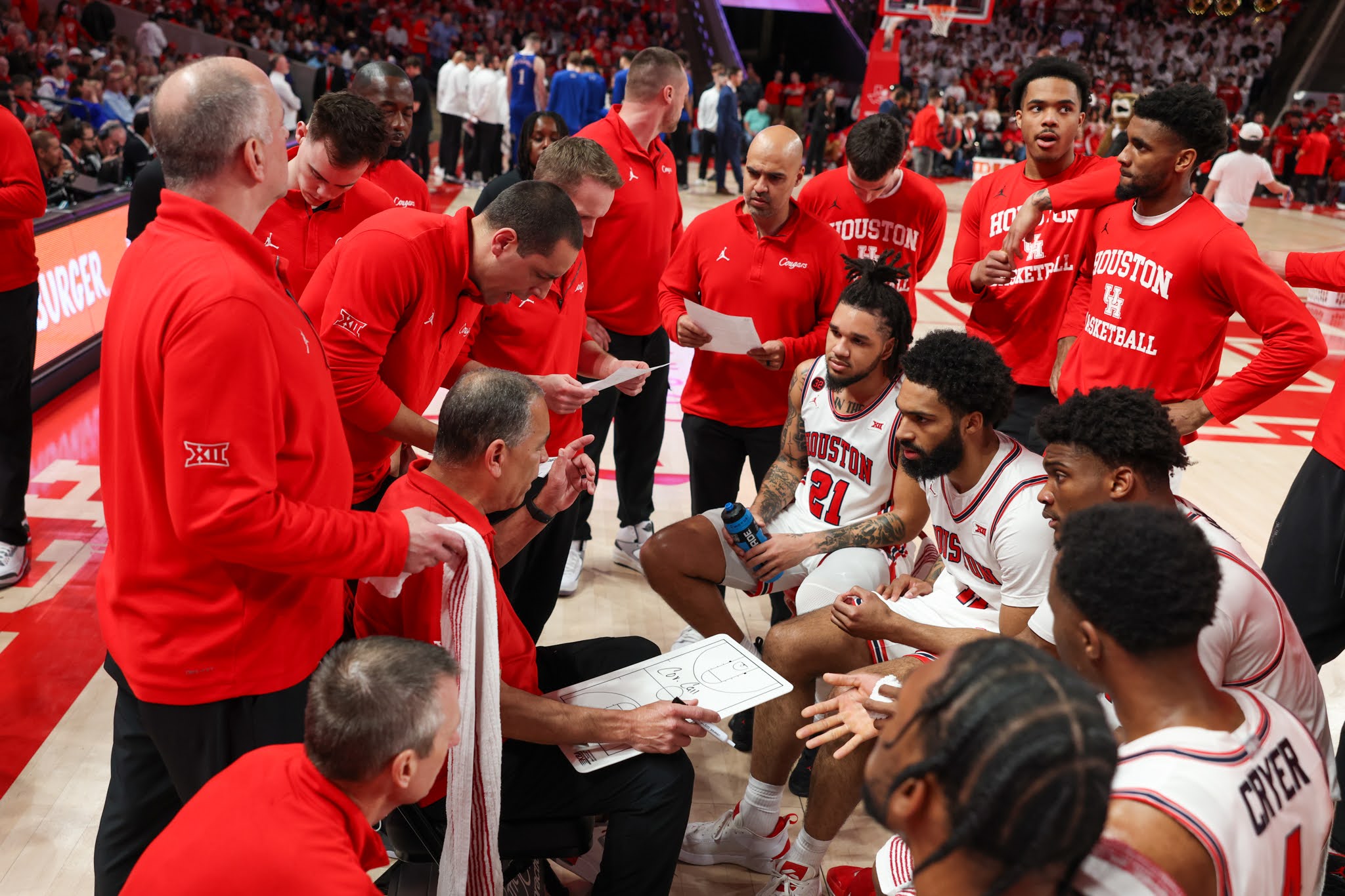 Kelvin Sampson leads the huddle » GoCoogs.com