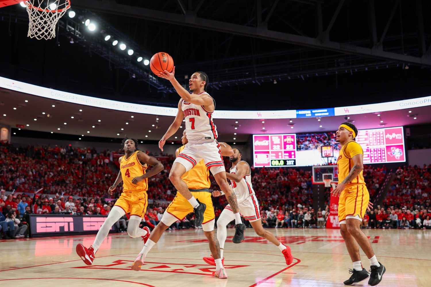 Milos Uzan blows by Tamin Lipsey » GoCoogs.com